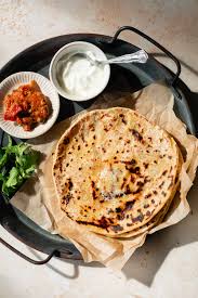 Triangle tofu pieces stir fried in a tangy Indo-Chinese style sauce
